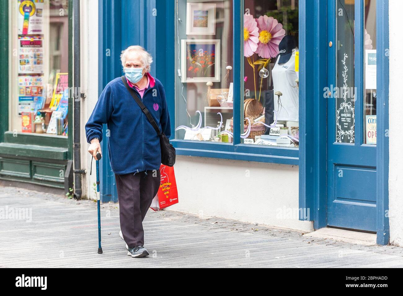 Clonakilty, West Cork, Ireland. 19th May, 2020. A man wears a face mask ...