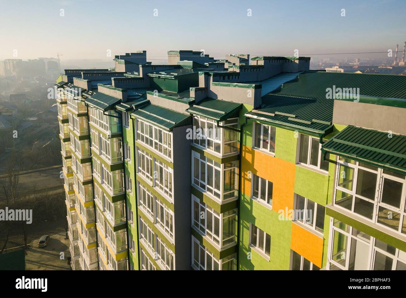 Aerial view of a tall residential apartment building with many windows ...