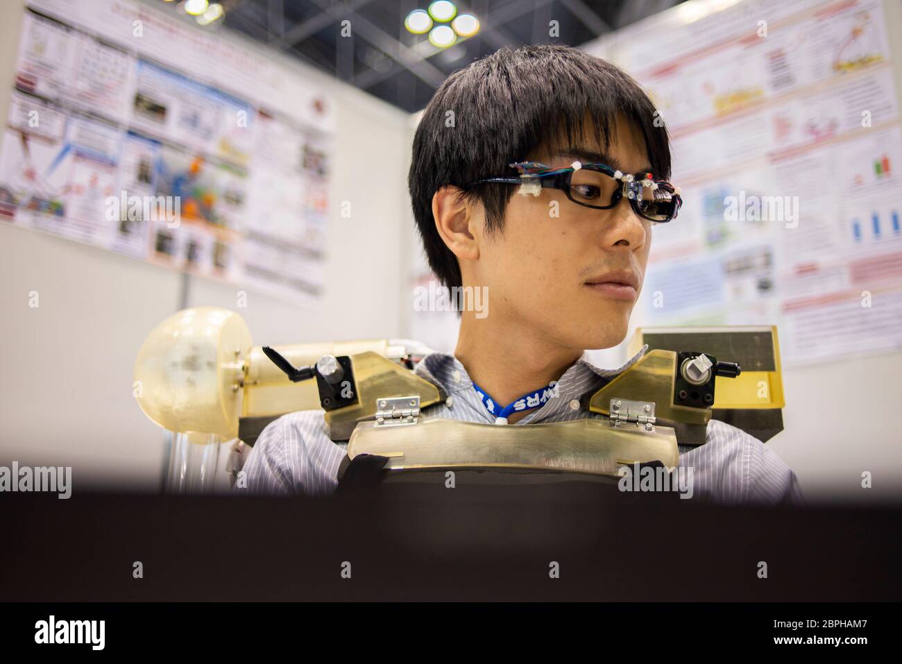 An assisting robot is demonstrated during the Japan Robot Week ...