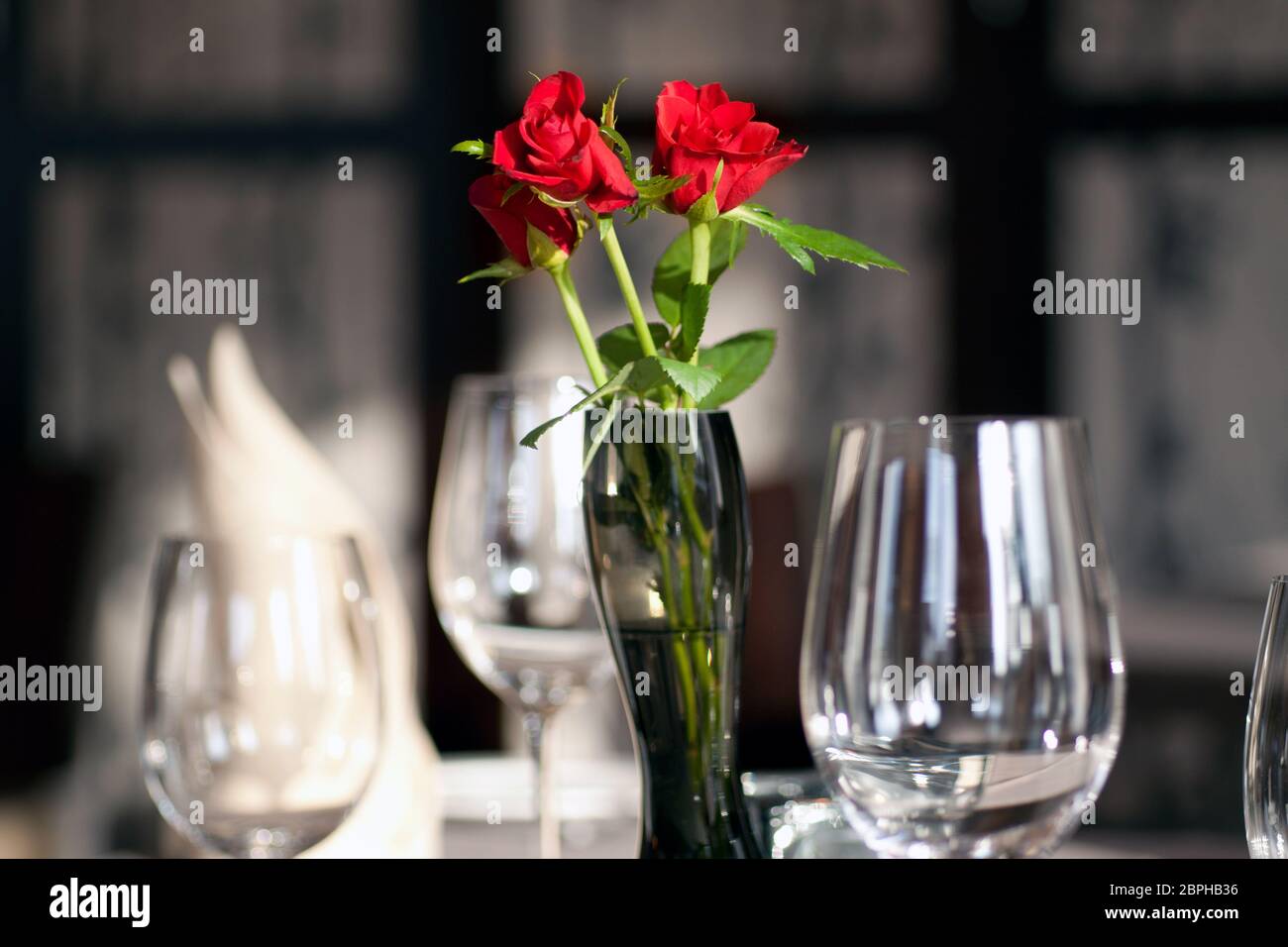 Elegant Table in modern Restaurant with Roses in a glass vase Stock ...