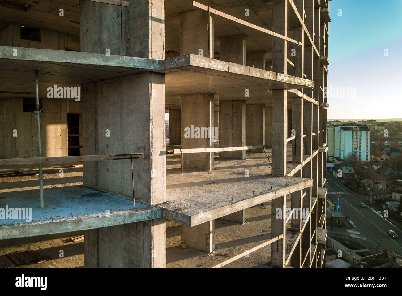 Aerial view of concrete frame of tall apartment building under ...