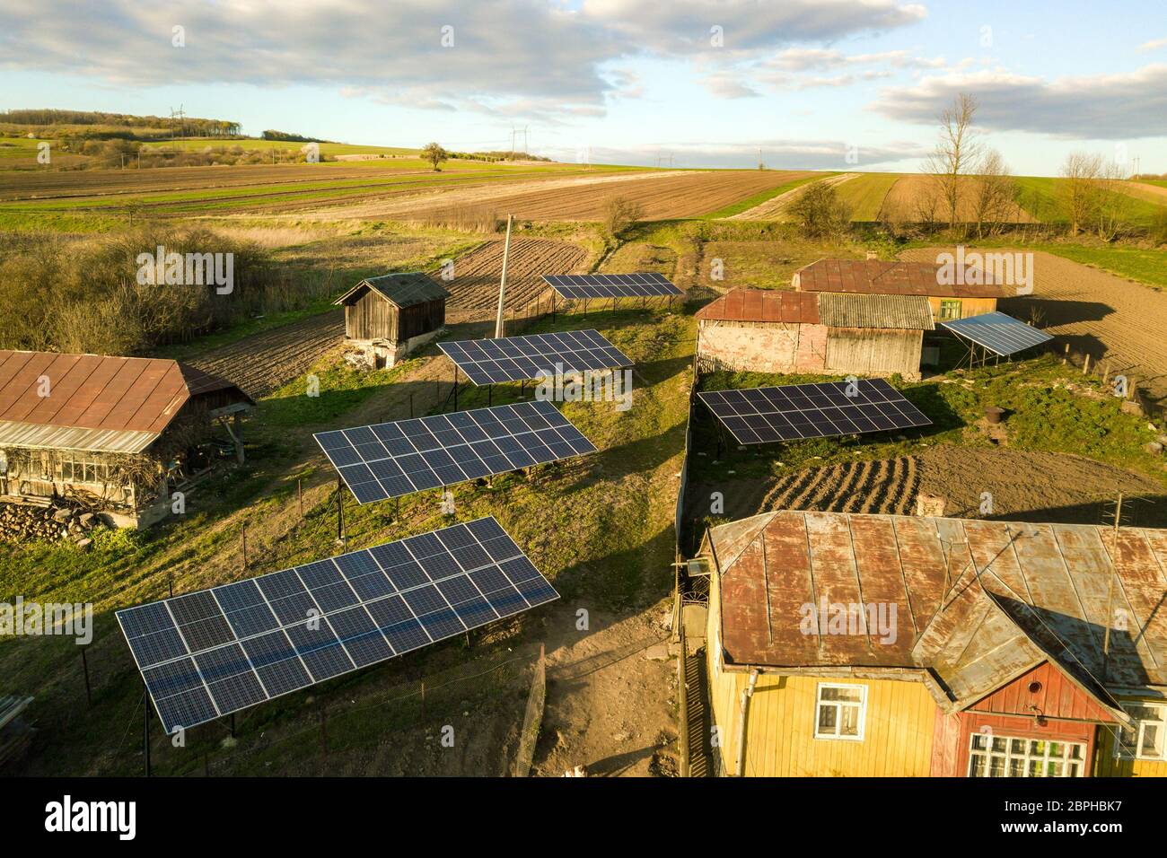 Aerial top down view of solar panels in green rural village yard Stock ...