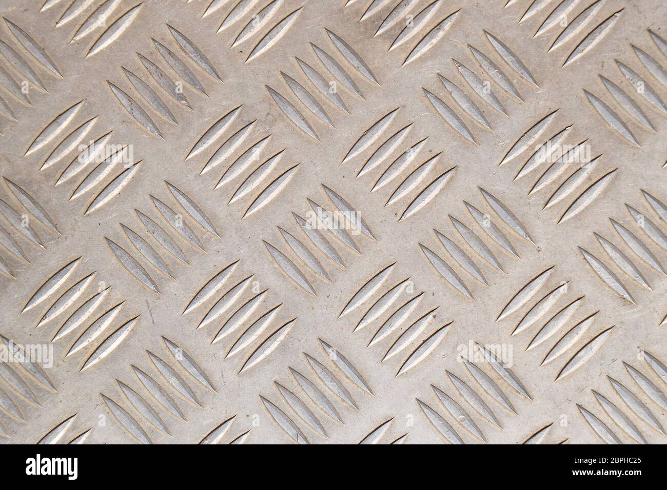 Background metal texture with anti-slip relief. metal sheet against ...