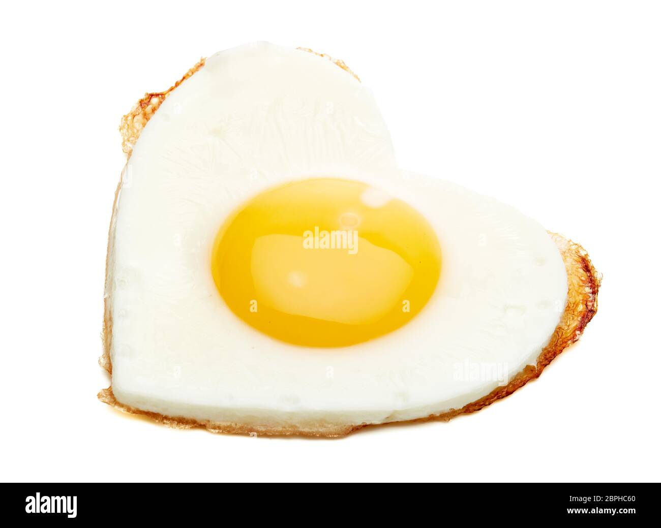 Fried egg in the shape of a heart isolated on a white background Stock ...