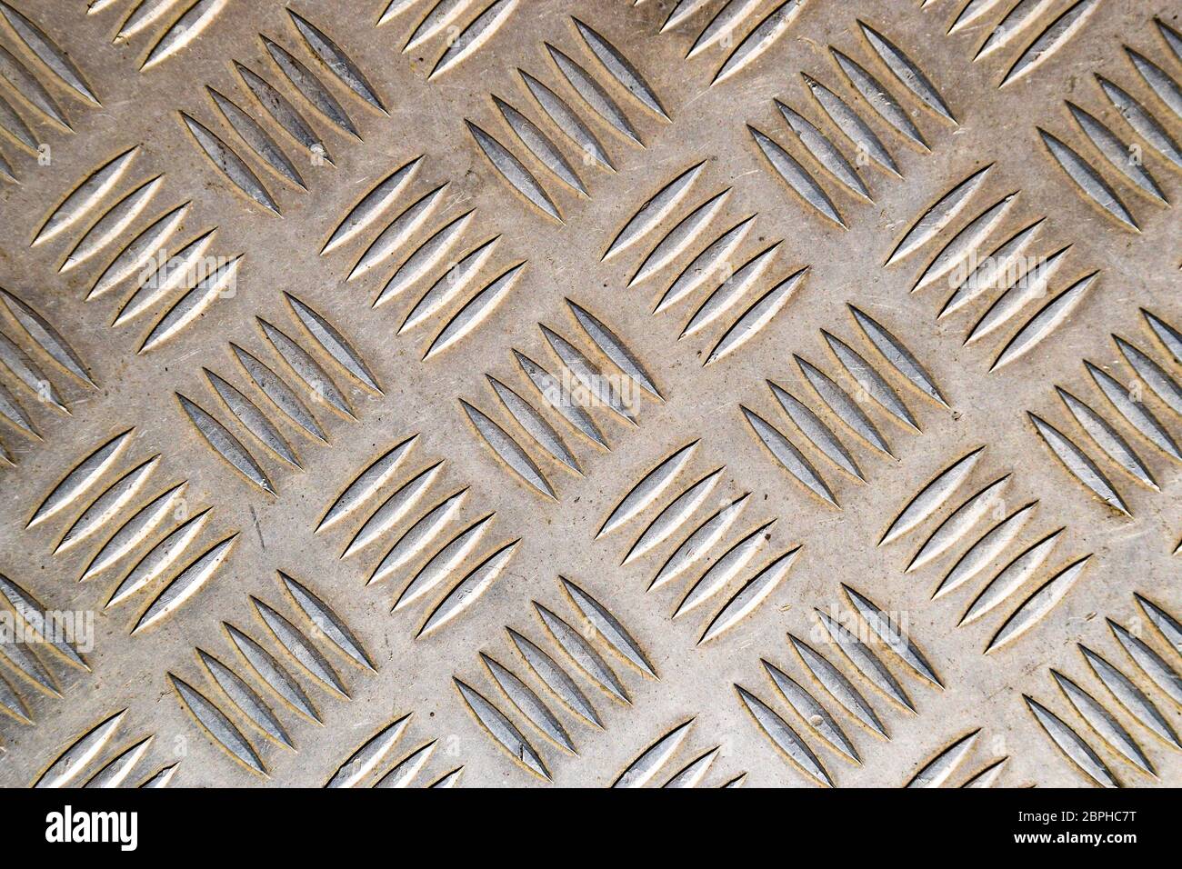 Background metal texture with anti-slip relief. metal sheet against ...