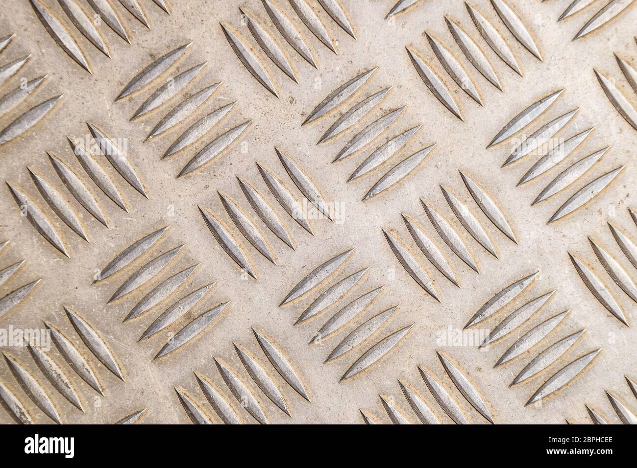 Background metal texture with anti-slip relief. metal sheet against ...