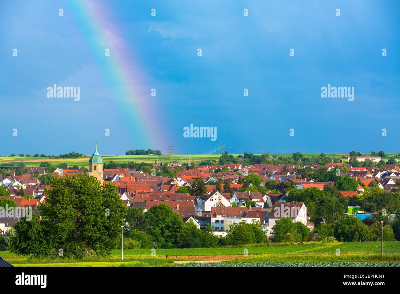 idyllic view to a village with rainbow Stock Photo - Alamy