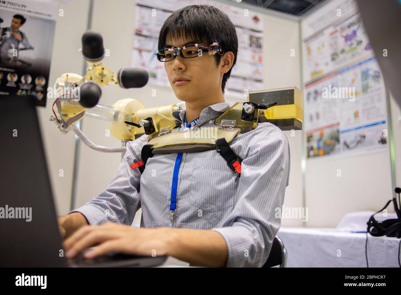 An assisting robot is demonstrated during the Japan Robot Week ...