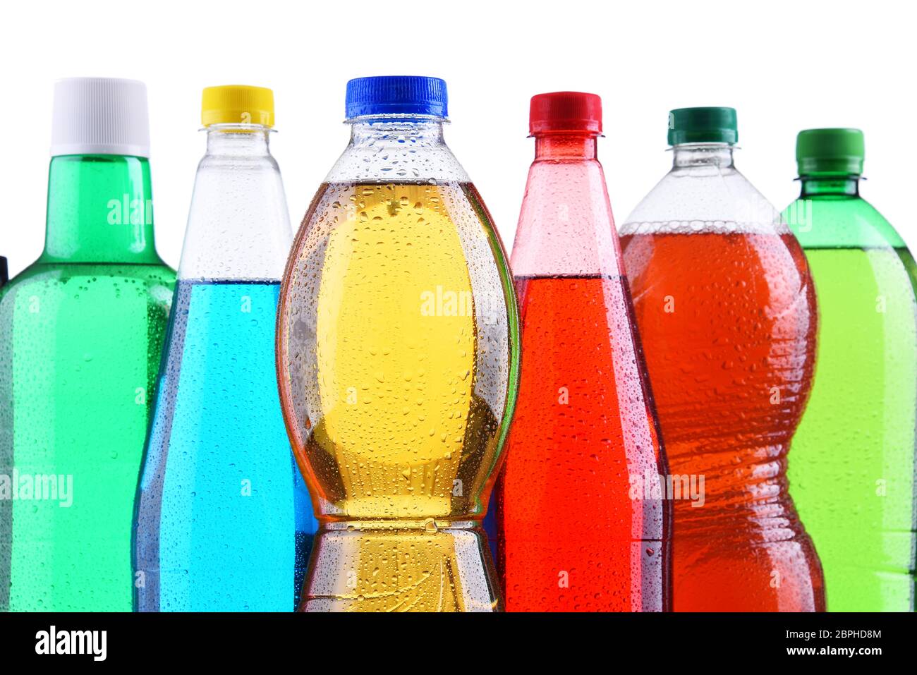 Plastic bottles of assorted carbonated soft drinks in variety of colors ...