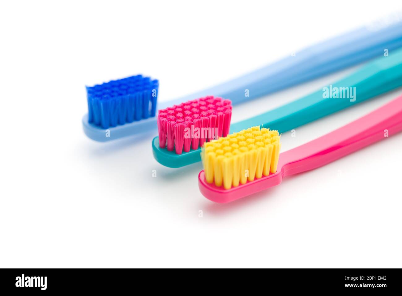 Colorful toothbrushes isolated on white background Stock Photo - Alamy