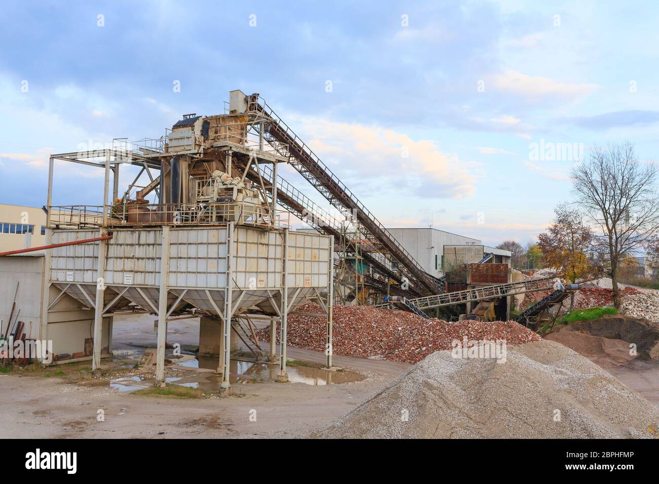Stone quarry with silos and conveyor belts. Industrial equipment ...
