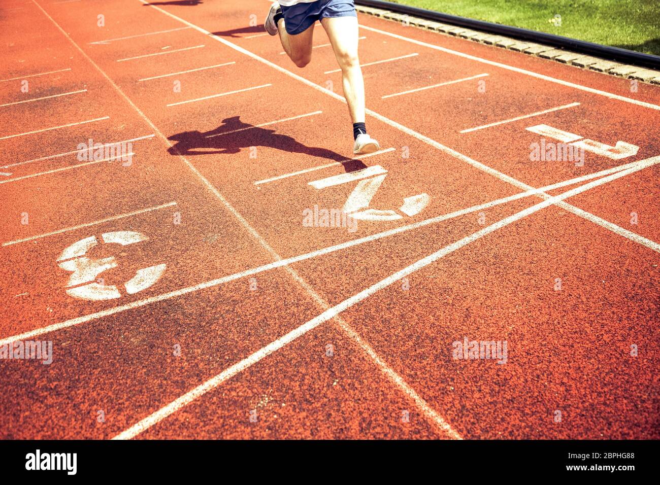 athlete on running track Stock Photo - Alamy
