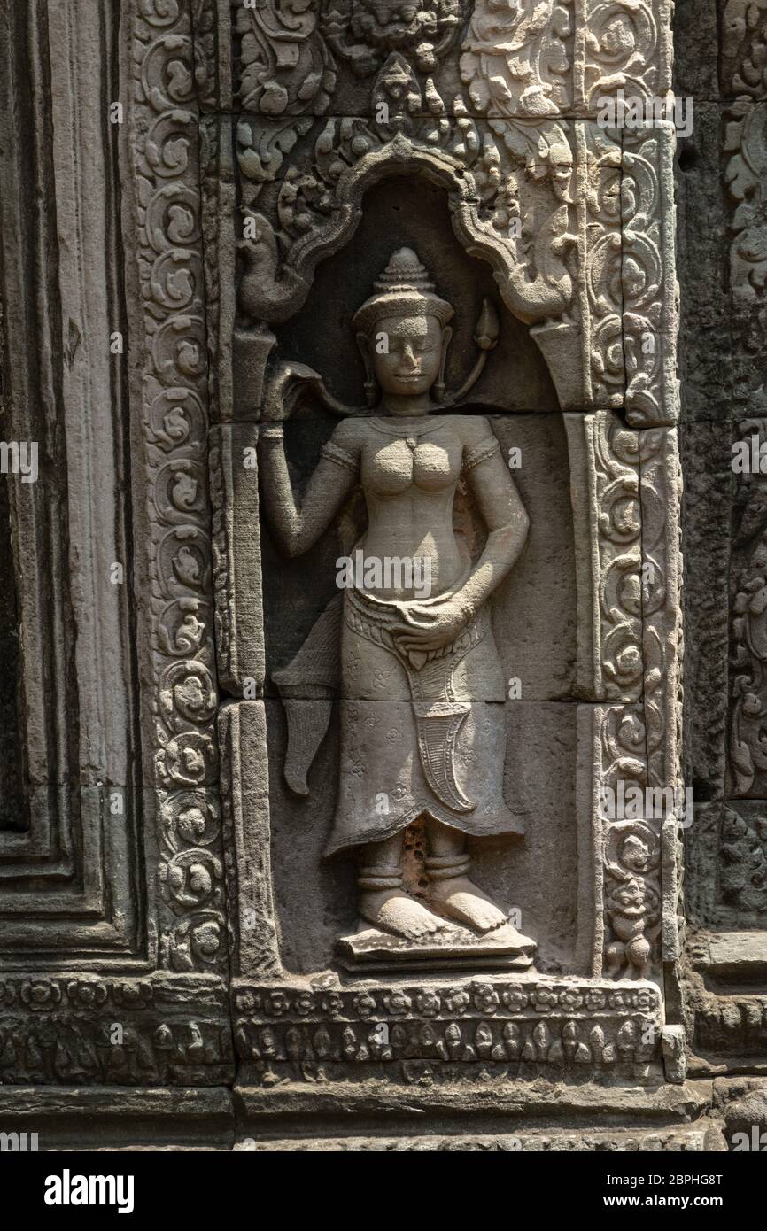 Statue of woman in decorated stone wall Stock Photo - Alamy