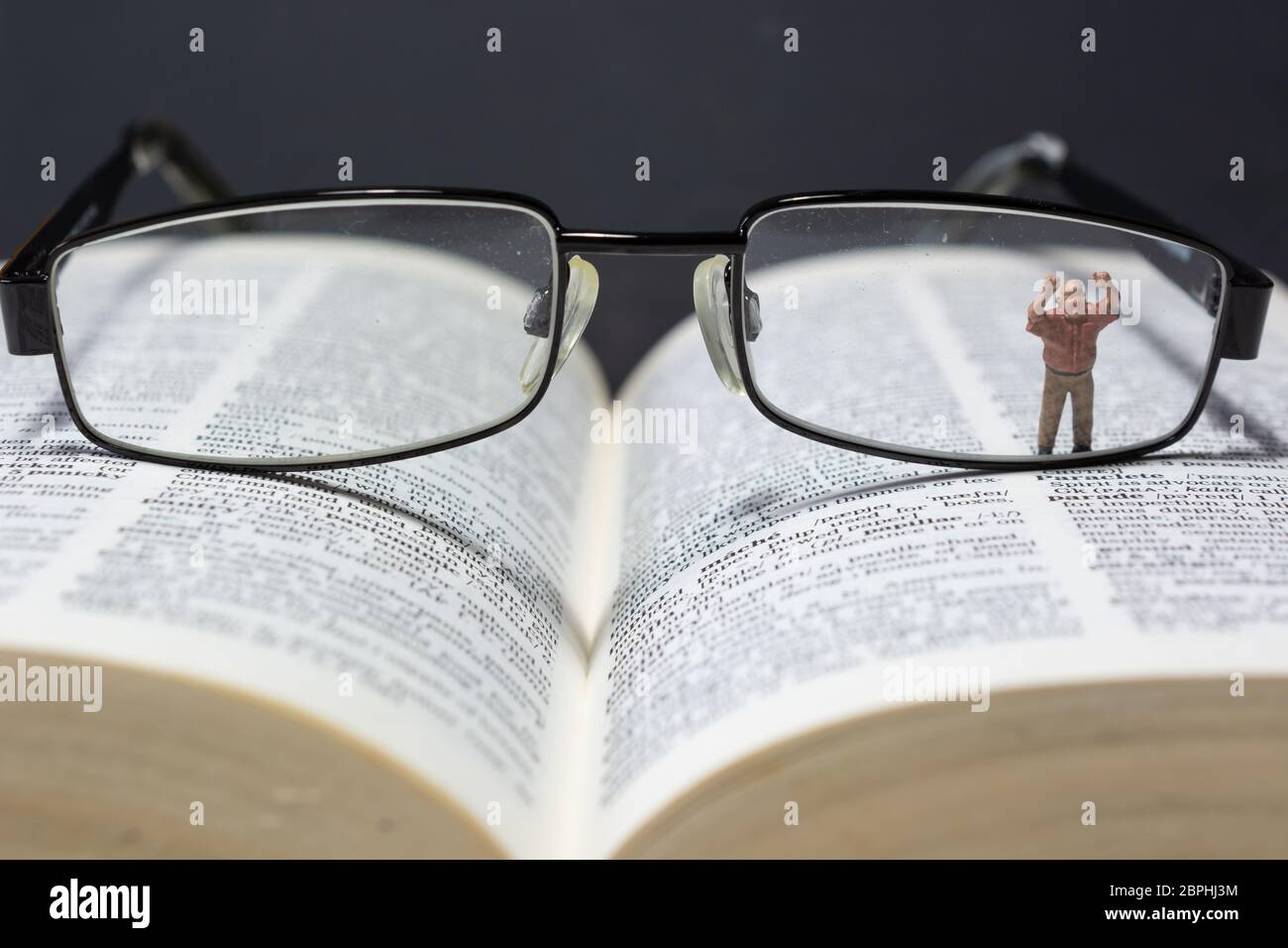 Book and spectacles, looking out through glasses Stock Photo - Alamy