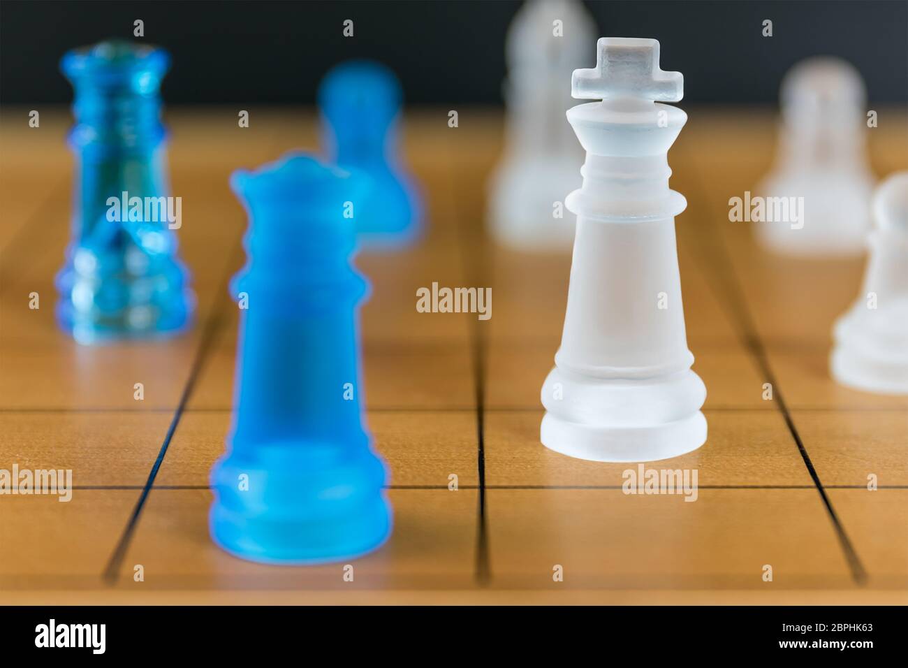 Close up chess pieces on a wood chessboard Stock Photo - Alamy