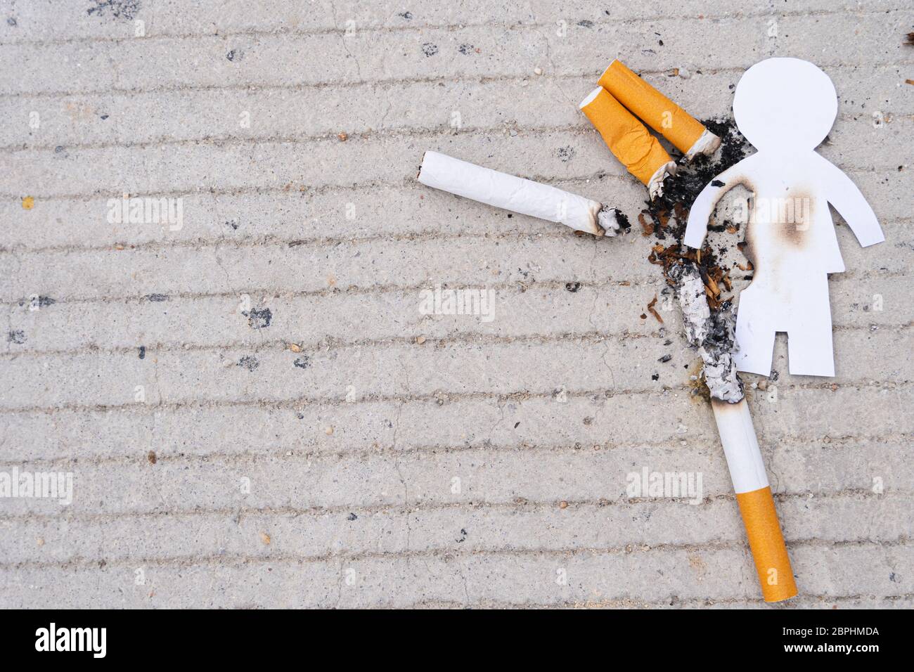 Paper cut of man destroyed by cigarette. Smoking destroying life ...