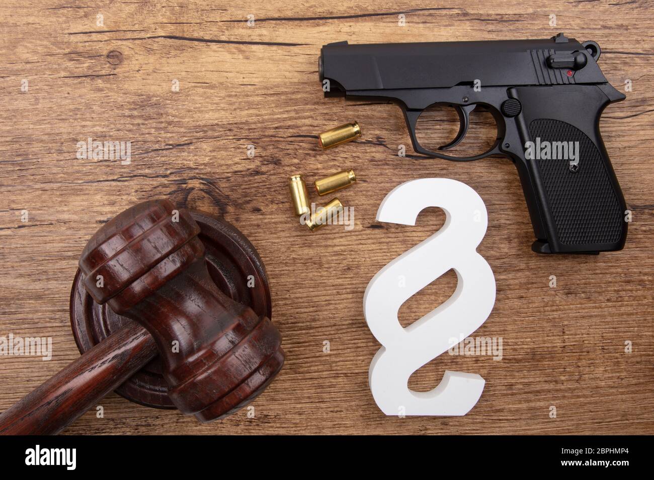 Black Pistol with court hammer and bullets, paragraph symbol Stock ...