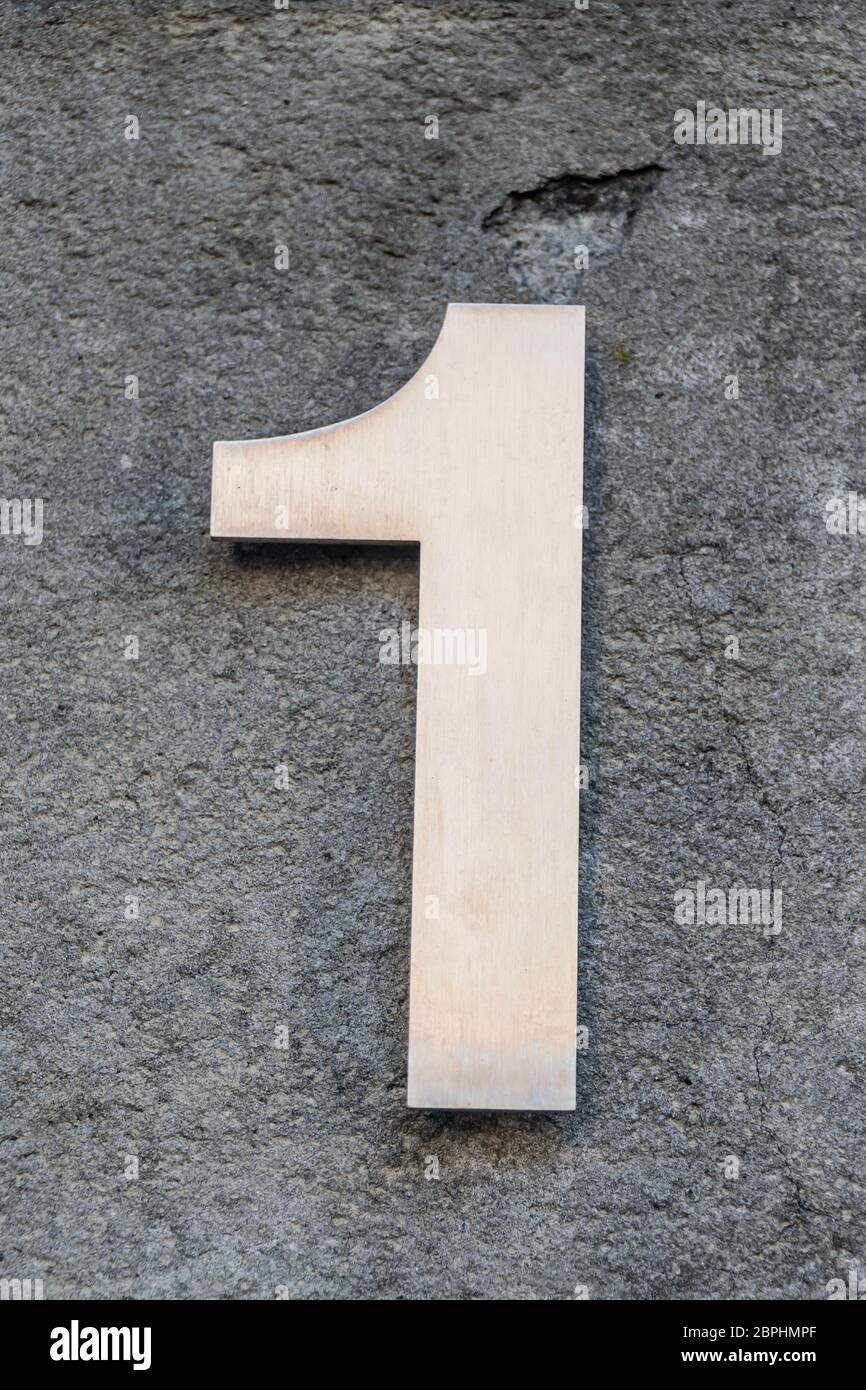 Number One on a old grey House Facade Stock Photo - Alamy