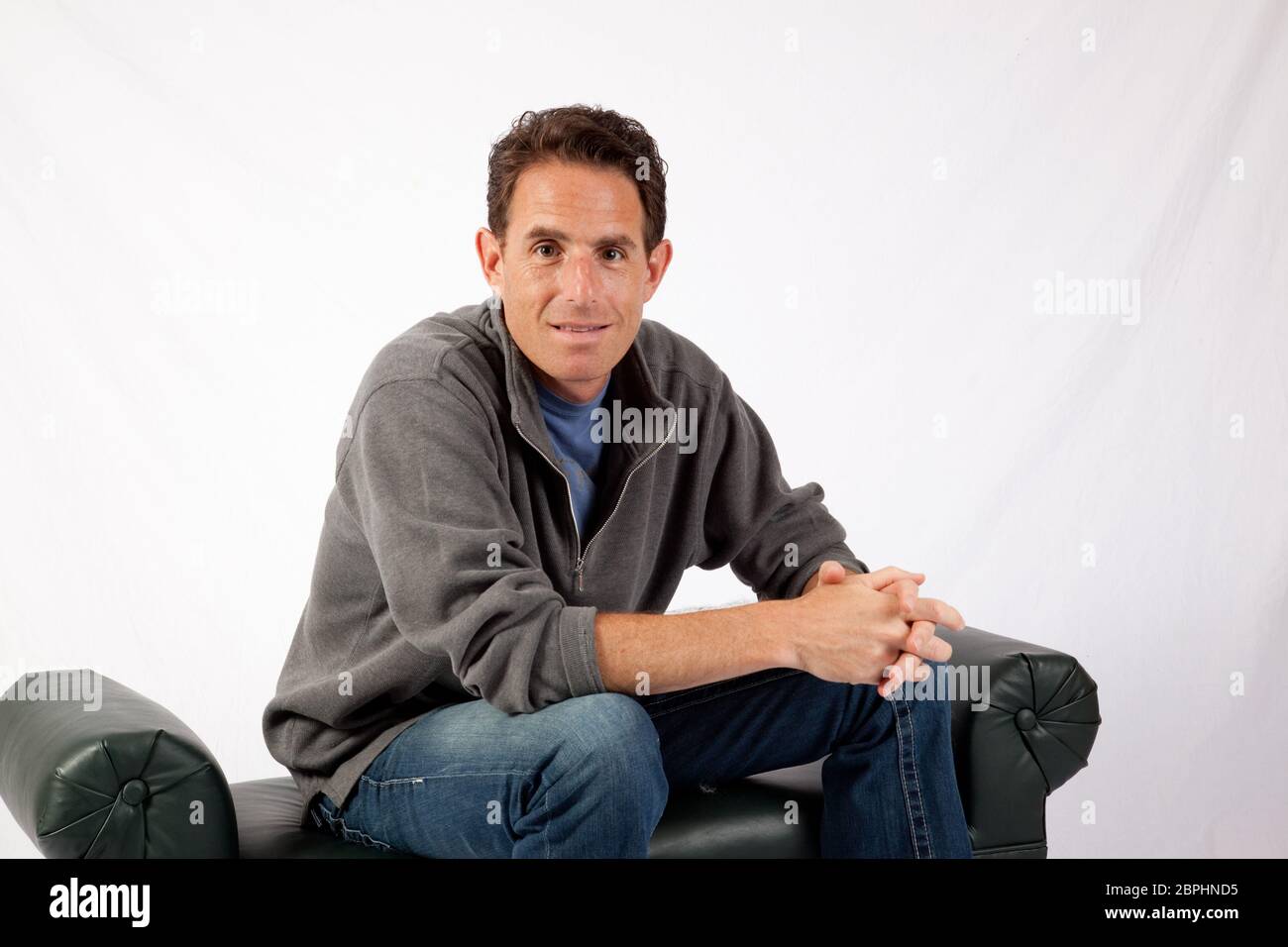 Thoughtful man sitting quietly Stock Photo - Alamy