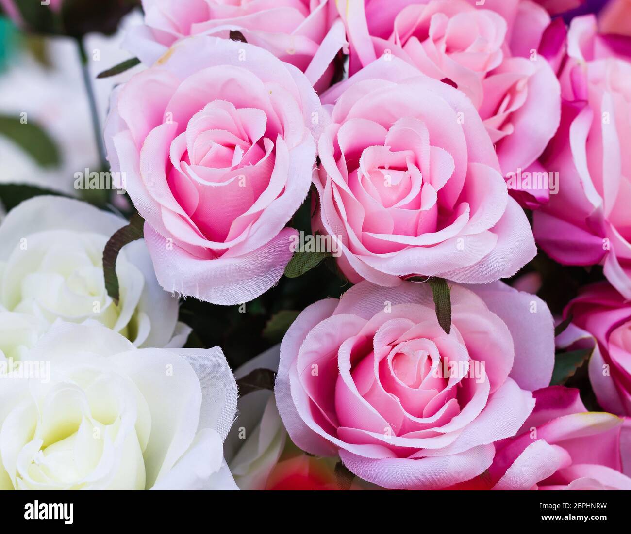 Pink fabric roses,Fake textile pink roses close-up floral background ...
