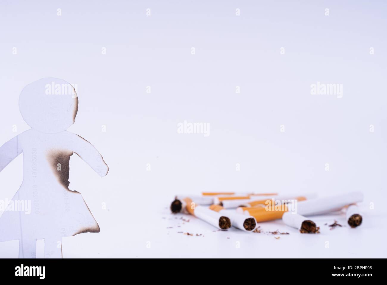 Paper cut of woman destroyed by cigarette. Smoking destroying life ...