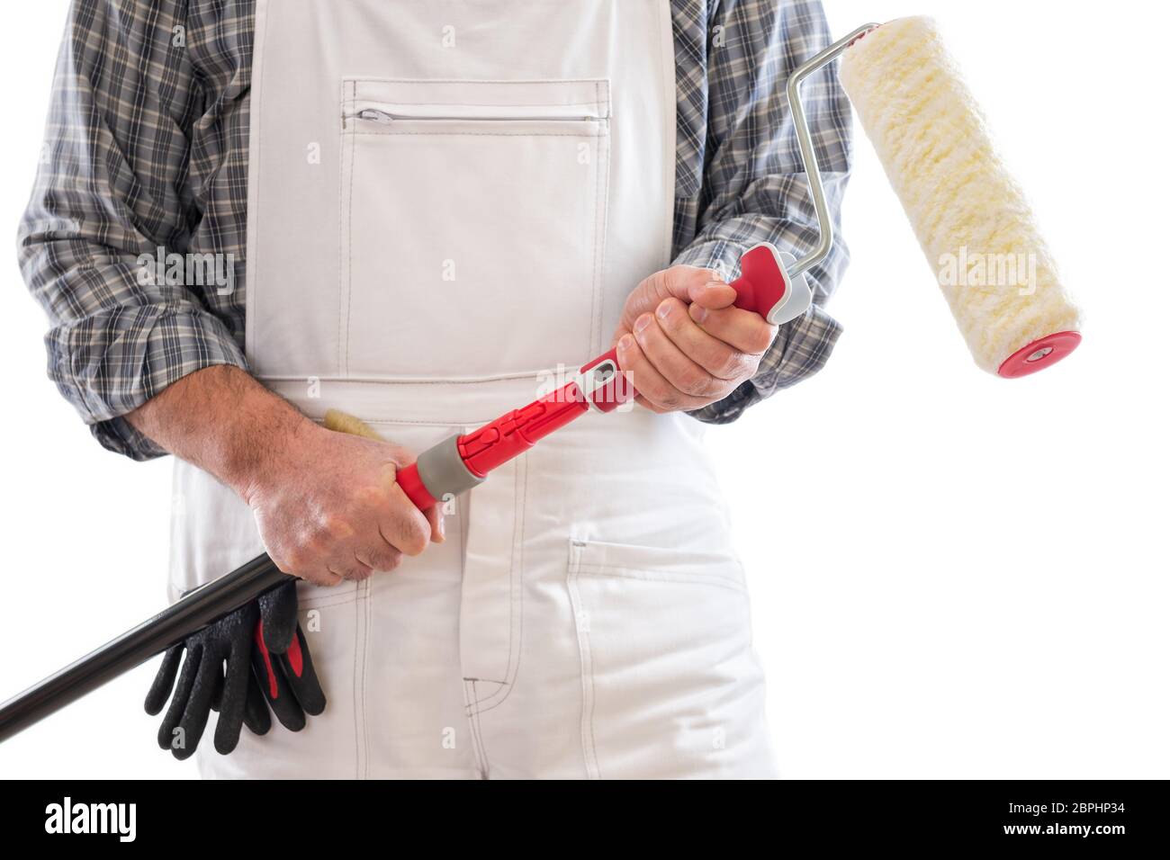 House painter worker with white work overalls, holds in his hand the ...
