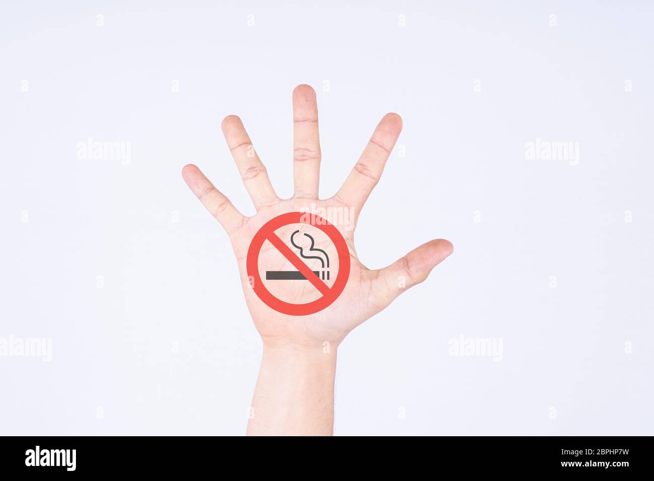 Open hand raised. No smoking sign painted. No smoking on white isolated ...