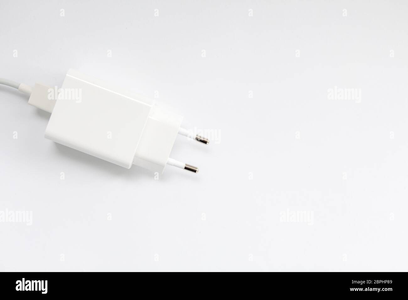 white mobile charger on white background Stock Photo - Alamy