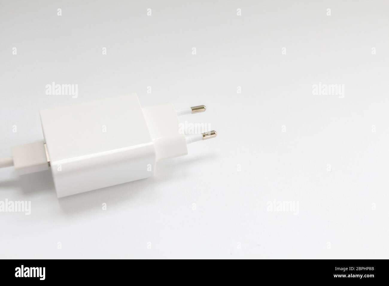 white mobile charger on white background Stock Photo - Alamy