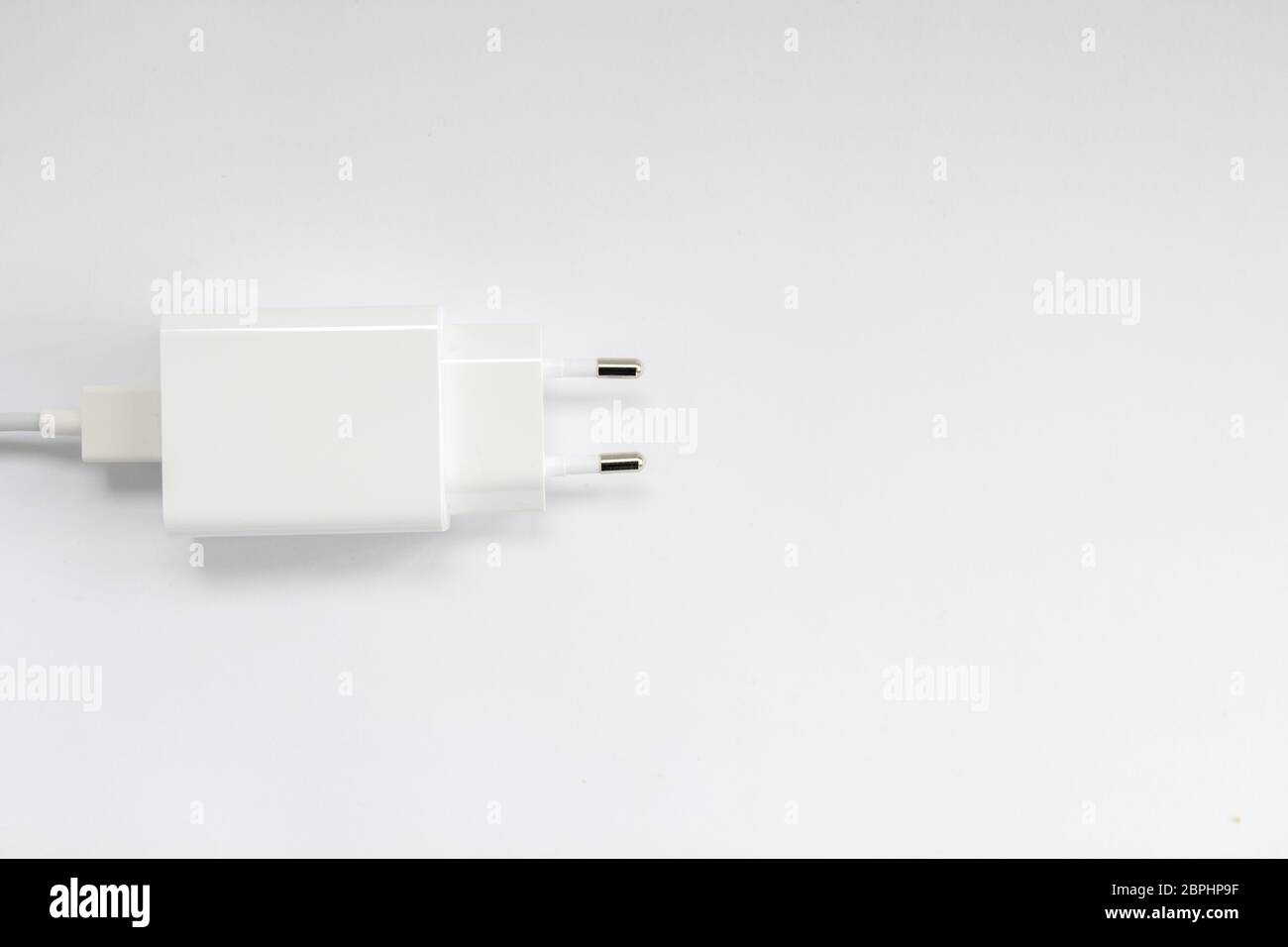 white mobile charger on white background Stock Photo - Alamy