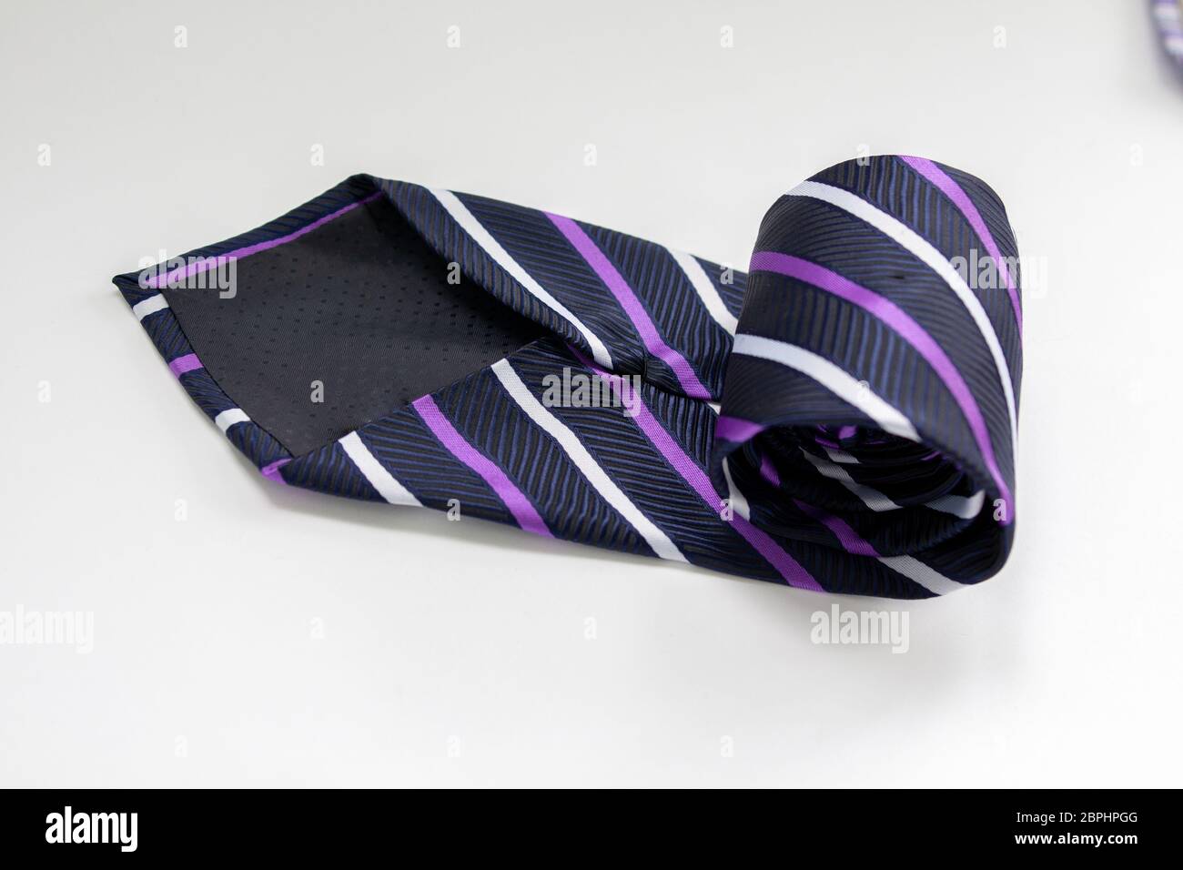 striped tie on white background Stock Photo - Alamy