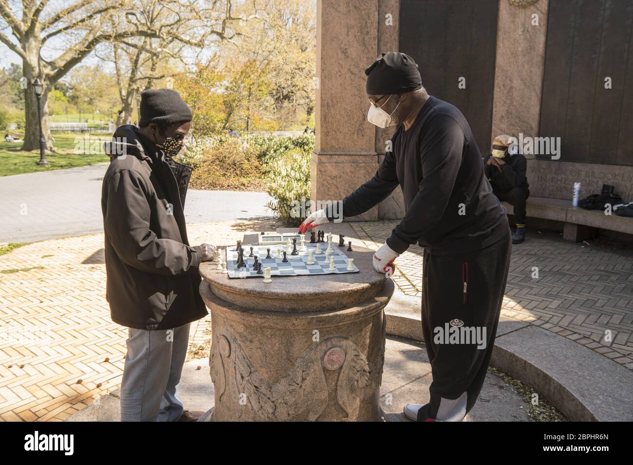 Masked men have a game of Chess in Prospect Park during the Covid-19 ...