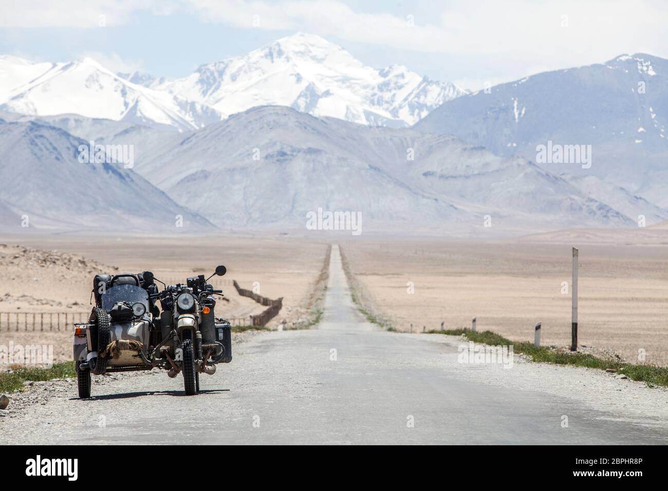 A sidecar motorcycle backed by a mountain range Stock Photo - Alamy