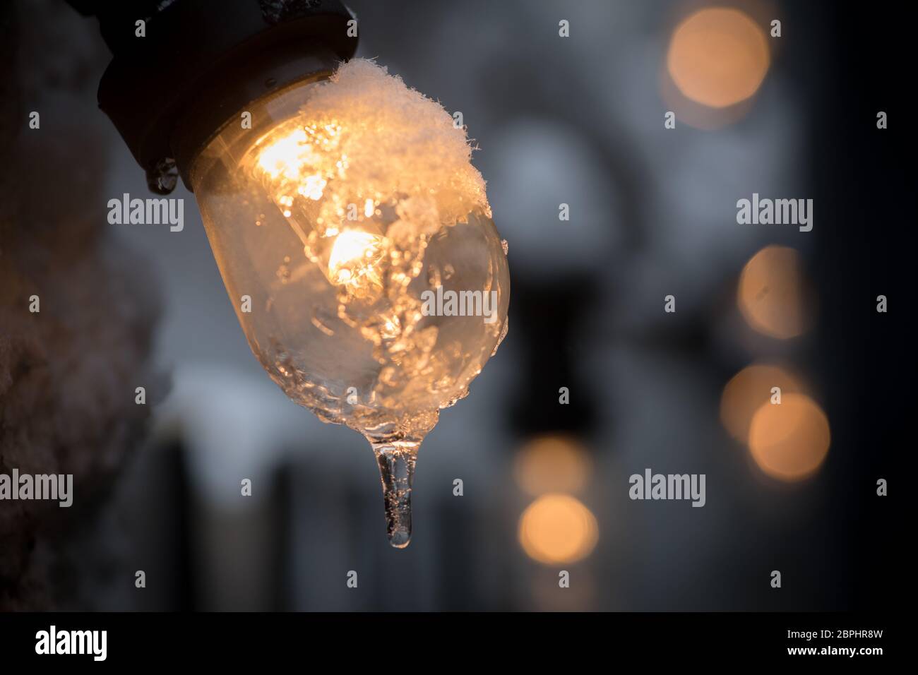 Color image of a frozen lit light bulb Stock Photo - Alamy