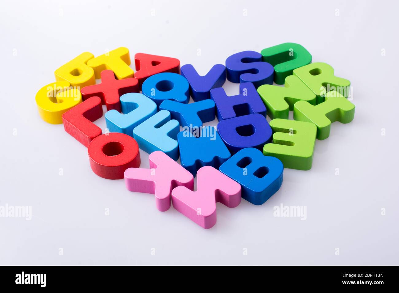 Colorful letter blocks shape heart on white background Stock Photo - Alamy