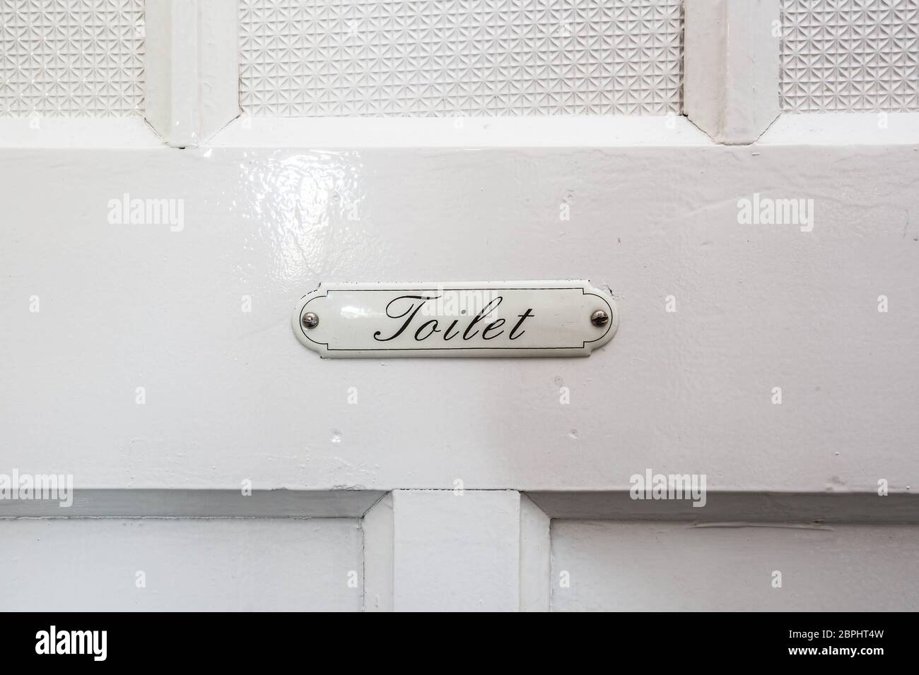 vintage toilet sign with the words toilet on a white wooden door public ...