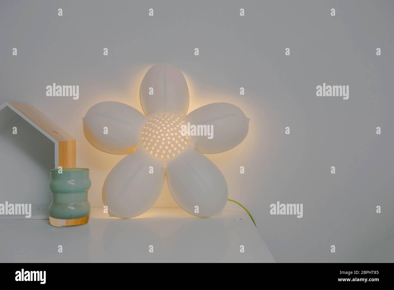 Flower shape lamp on white wall modern design, girly style neon Stock ...