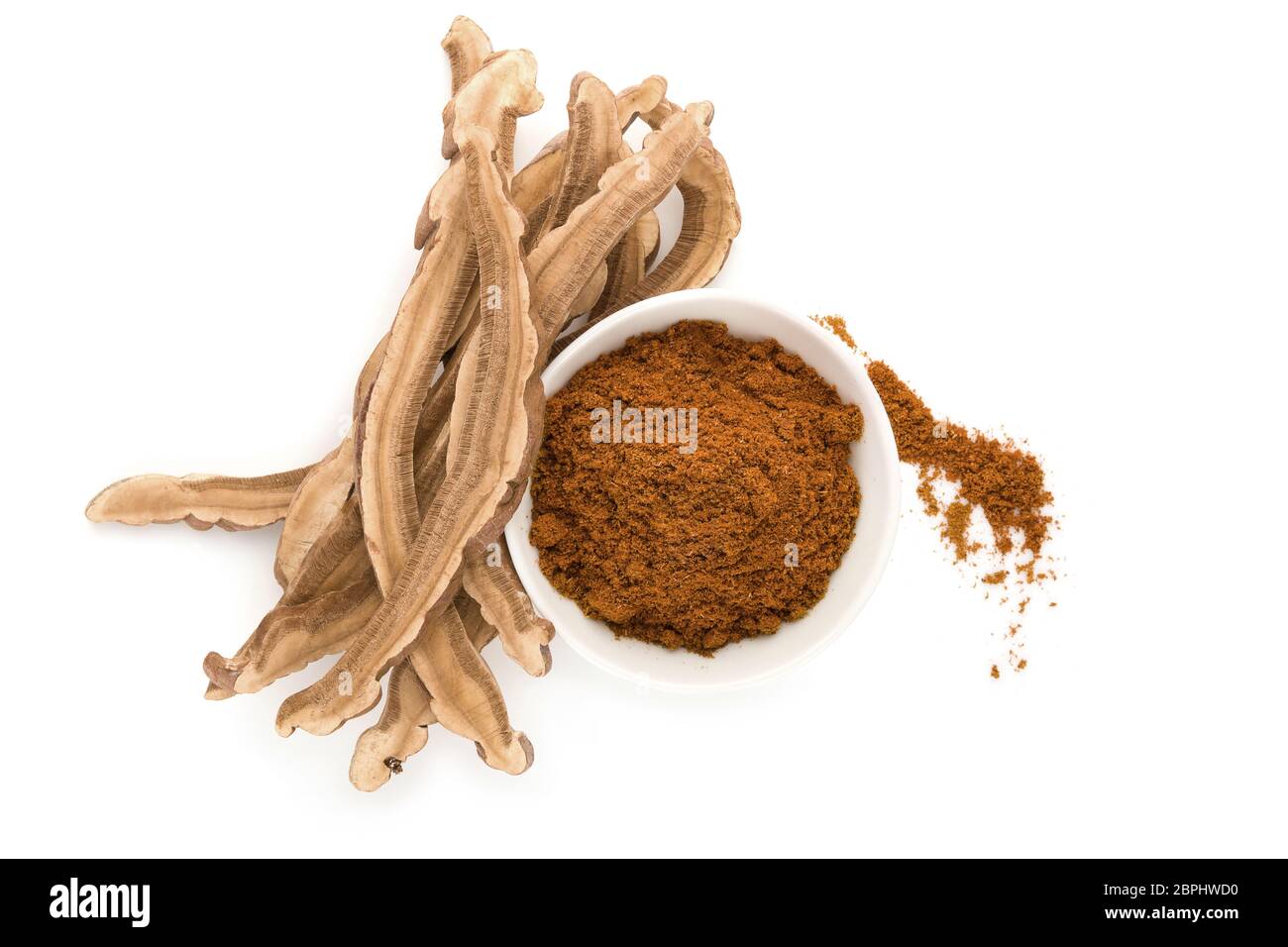 Reishi mushroom powder in bowl isolated on white background from above ...