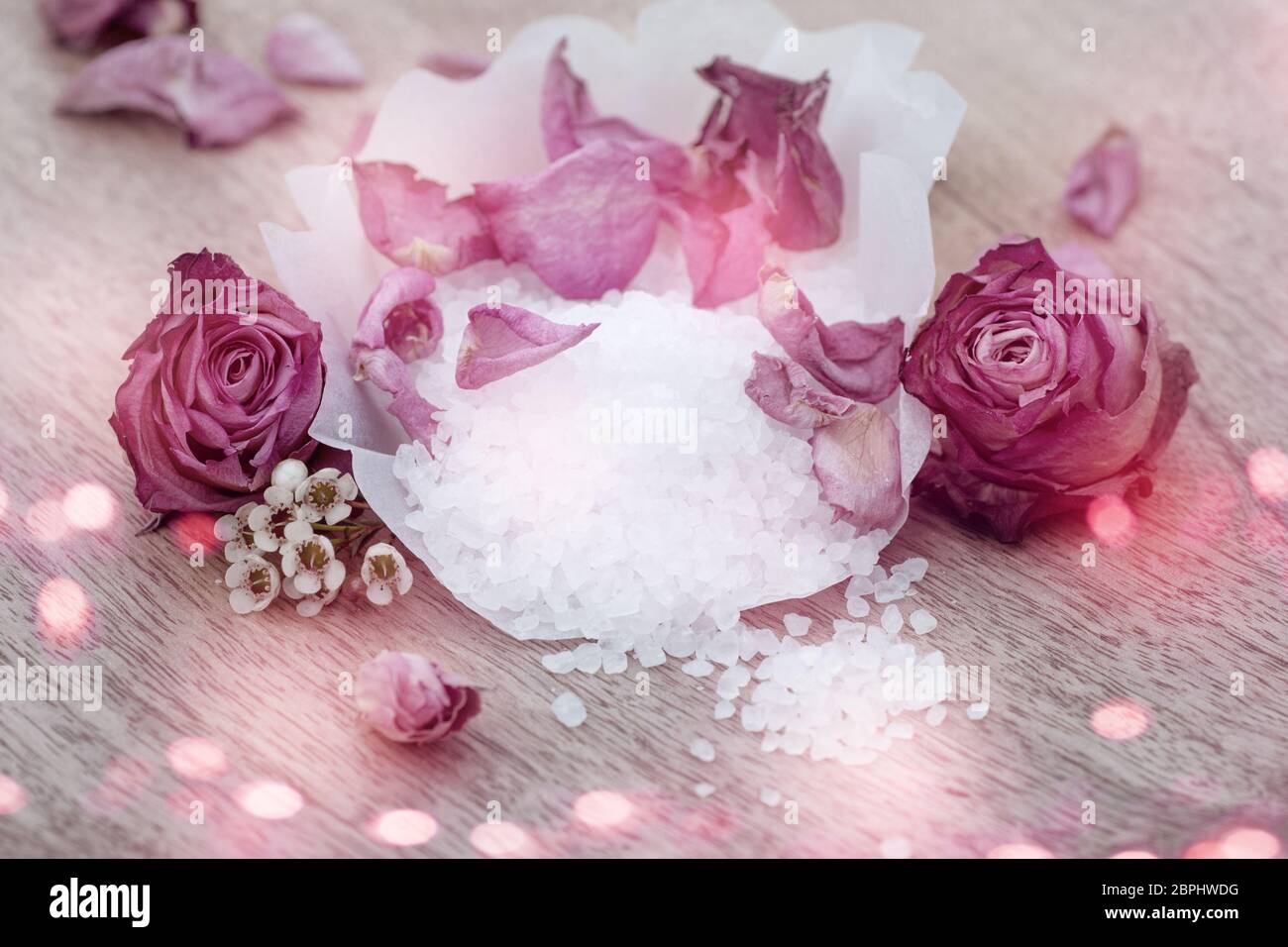 Wellbeing with aroma salt and pink roses for a wellness treatment Stock ...