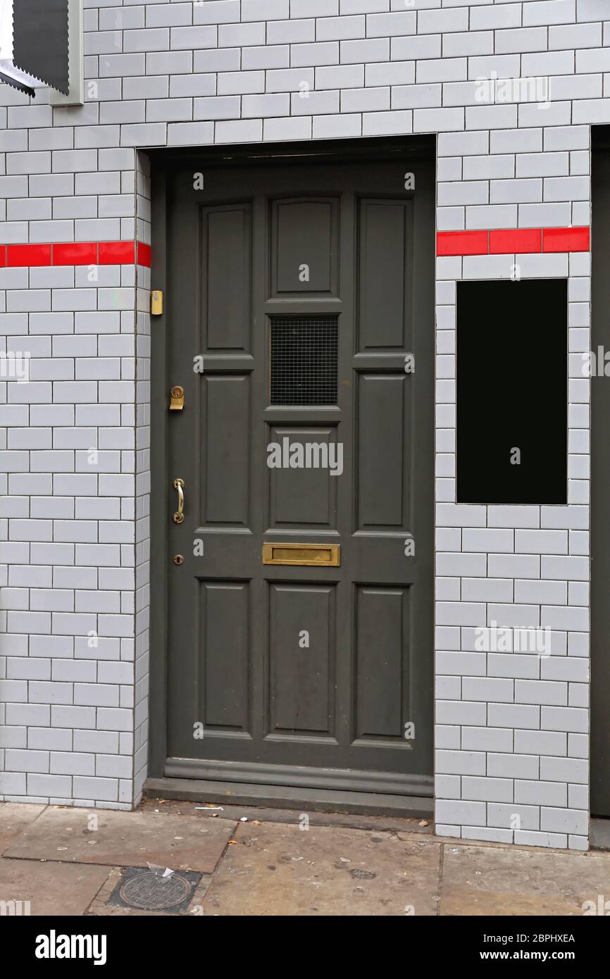 Club Door With Small Window Entrance in London Stock Photo - Alamy