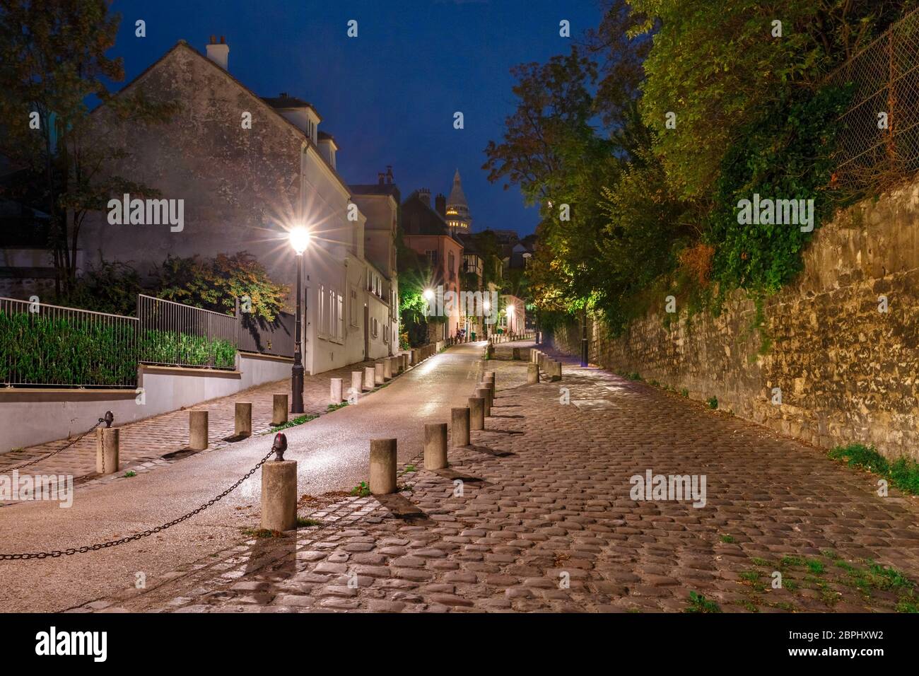 Empty street and the Sacre-Coeur at night, quarter Montmartre in Paris ...