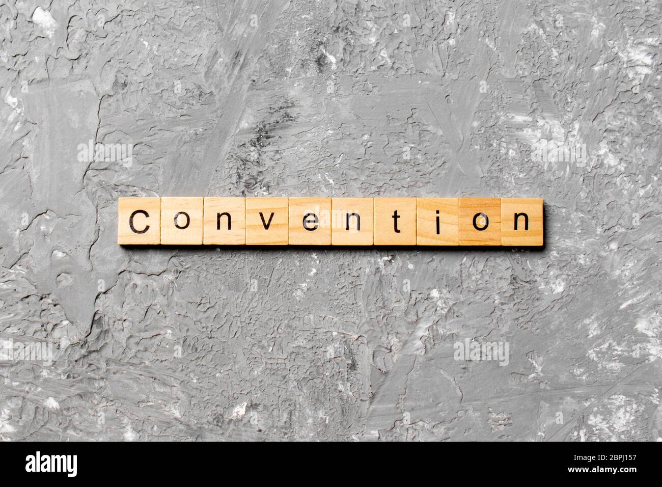 convention word written on wood block. convention text on cement table ...