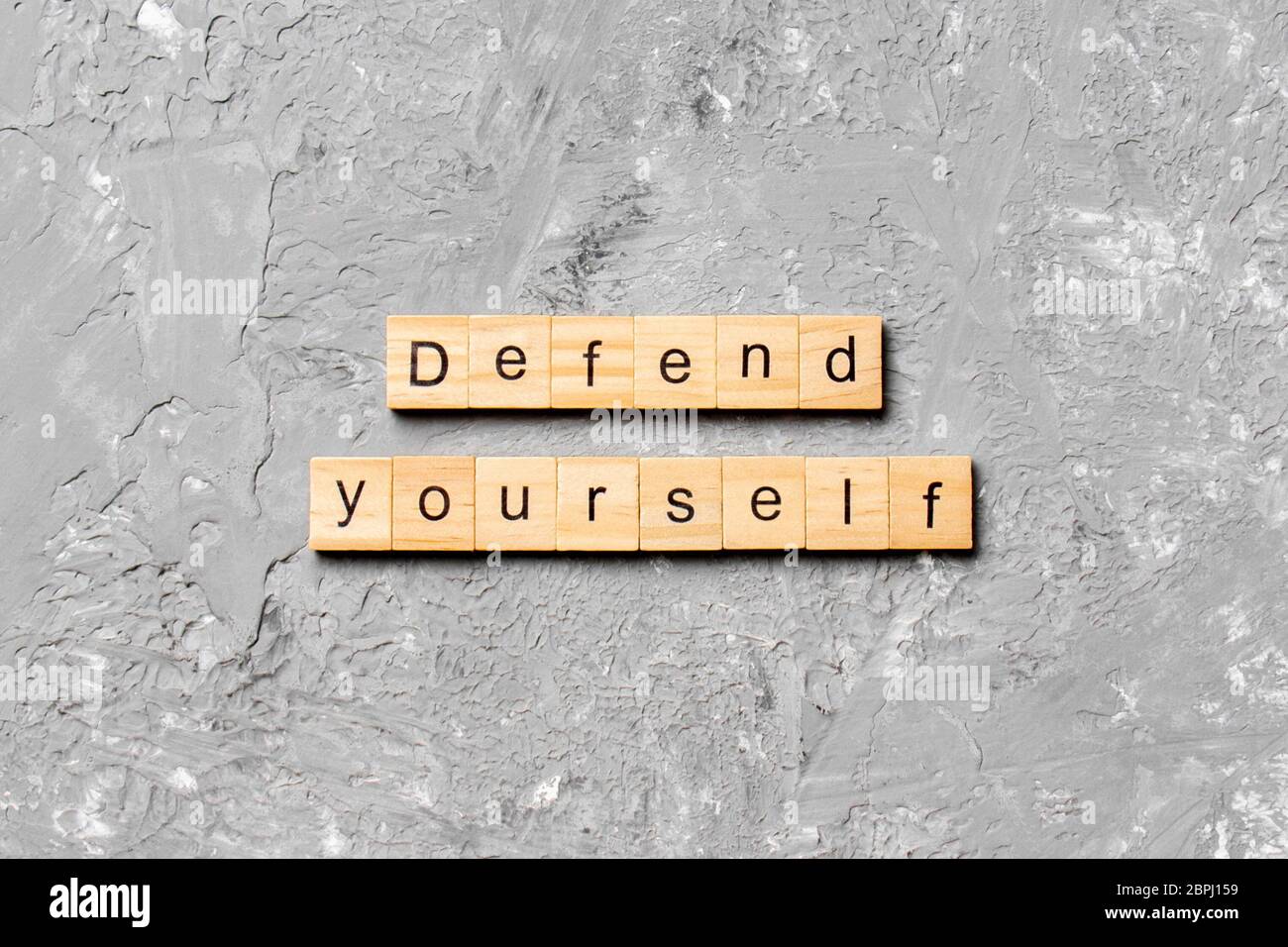defend yourself word written on wood block. defend yourself text on ... defend yourself word written on wood block. defend yourself text on ...