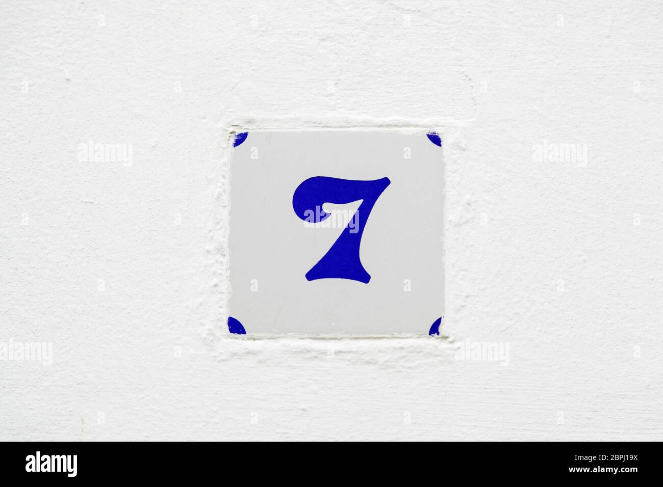 Number seven information on a wall, odd number detail, address Stock ...