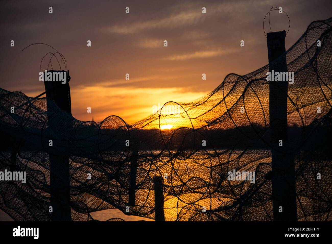 A fish trap is a stationary trap used for fishing Stock Photo - Alamy