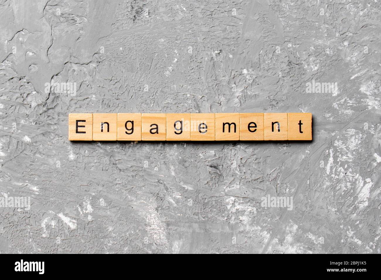 engagement word written on wood block. engagement text on table ...