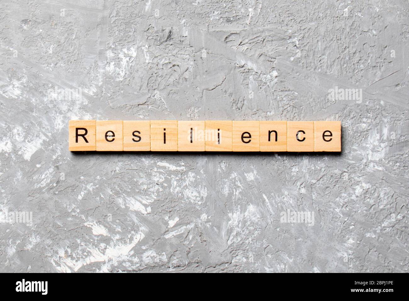 resilience word written on wood block. resilience text on table ...