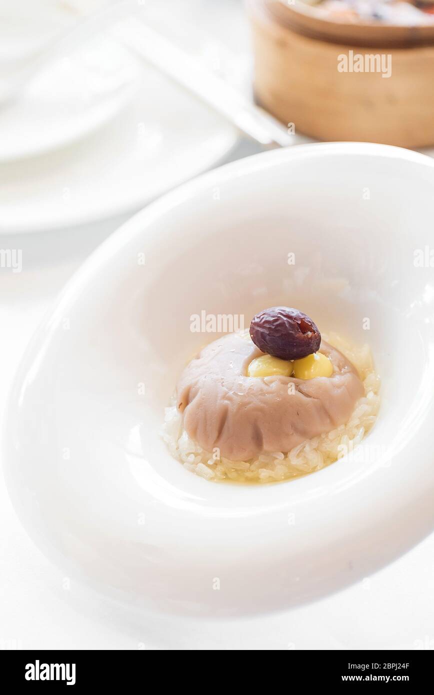 Chinese dessert, Chinese hot sticky rice and taro with ginkgo in sweet ...
