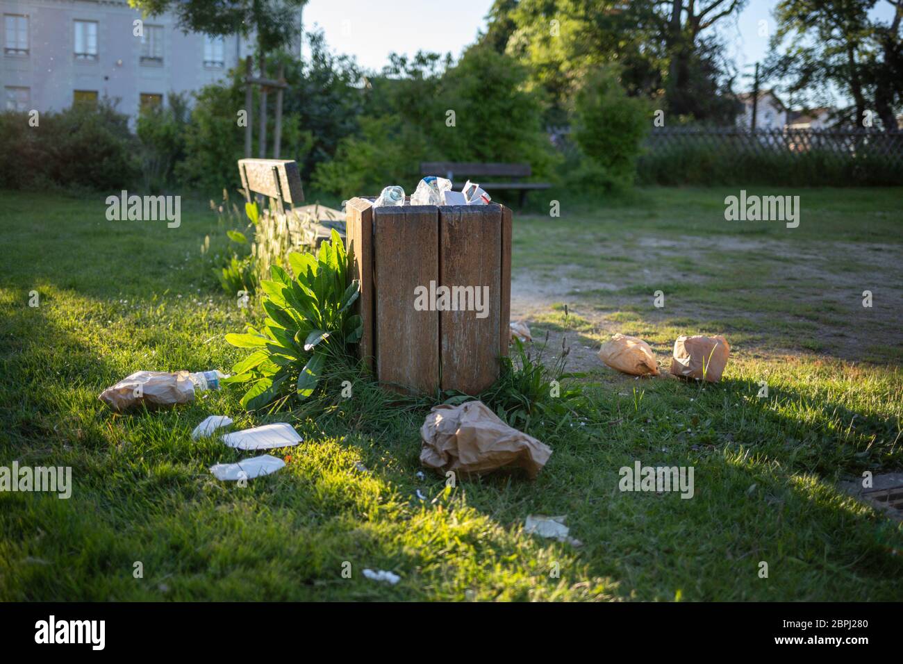 Overloaded trash bin on grass, garbage dump in public zone at green ...