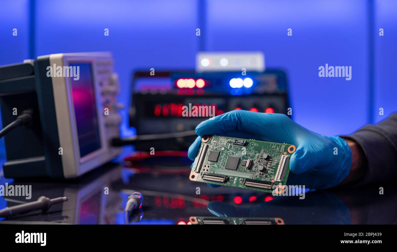 Debugging electronics device. PCB witch microcontroller in electronics ...